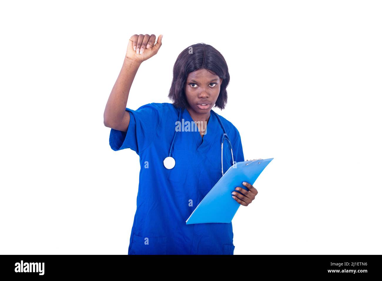 young charming nurse in lab coat standing on white background with ...