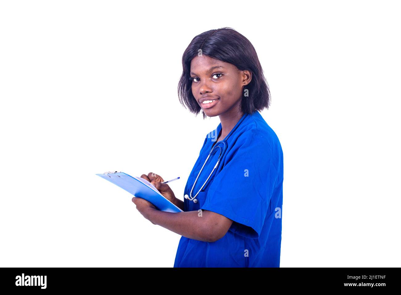 young charming nurse in lab coat standing on white background with ...