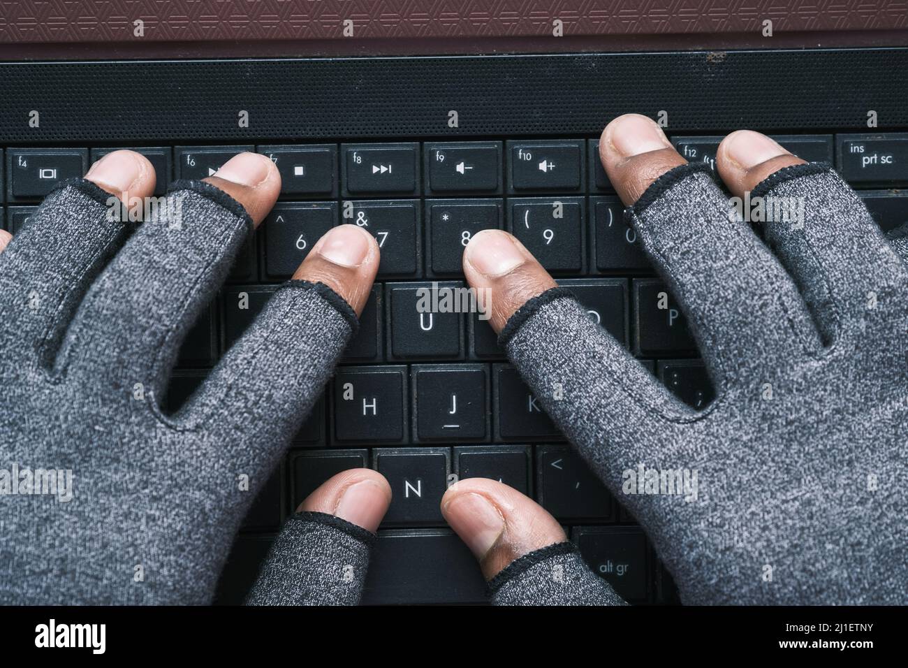 hacker hand stealing data from laptop top down Stock Photo - Alamy
