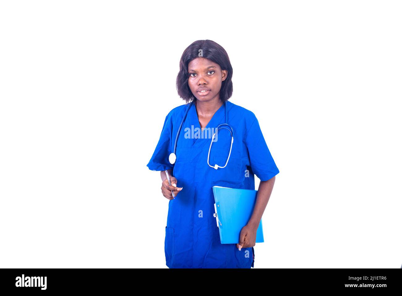 young charming nurse in lab coat standing on white background with ...