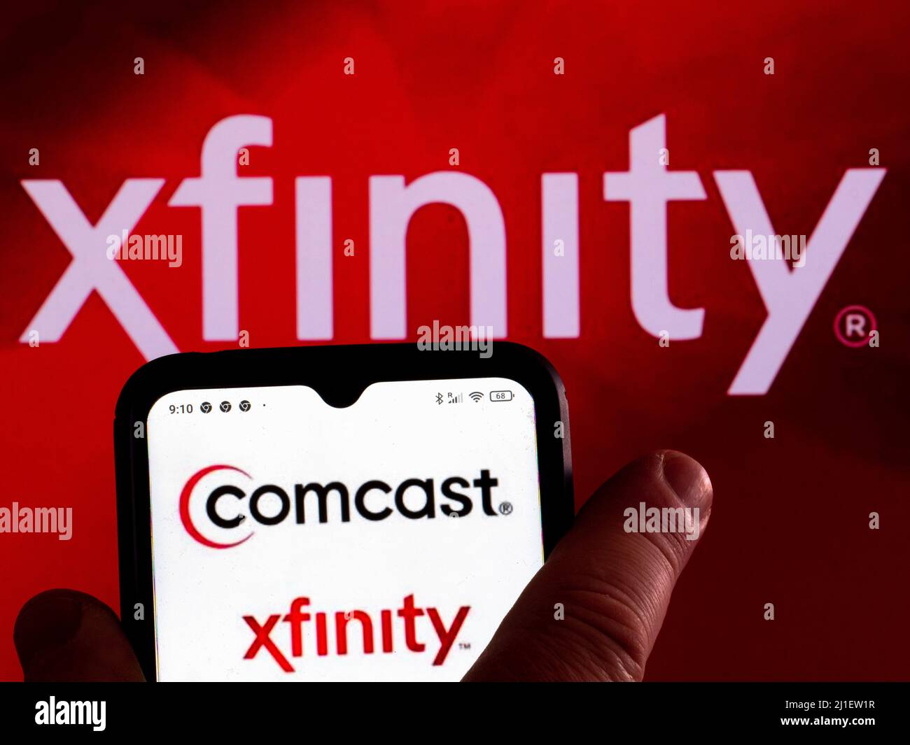 In this photo illustration, the Comcast Cable (Xfinity) logo is ...