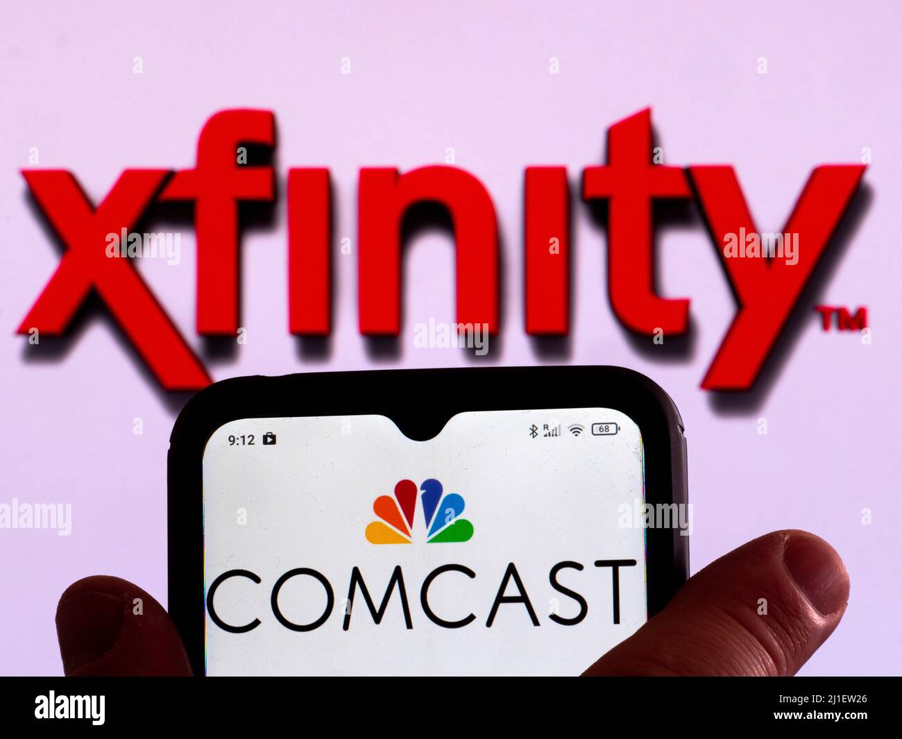 In this photo illustration, the Comcast Cable (Xfinity) logo is ...