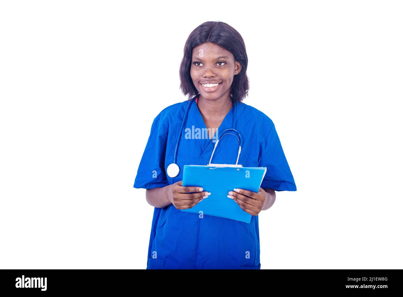 young charming nurse in lab coat standing on white background with ...