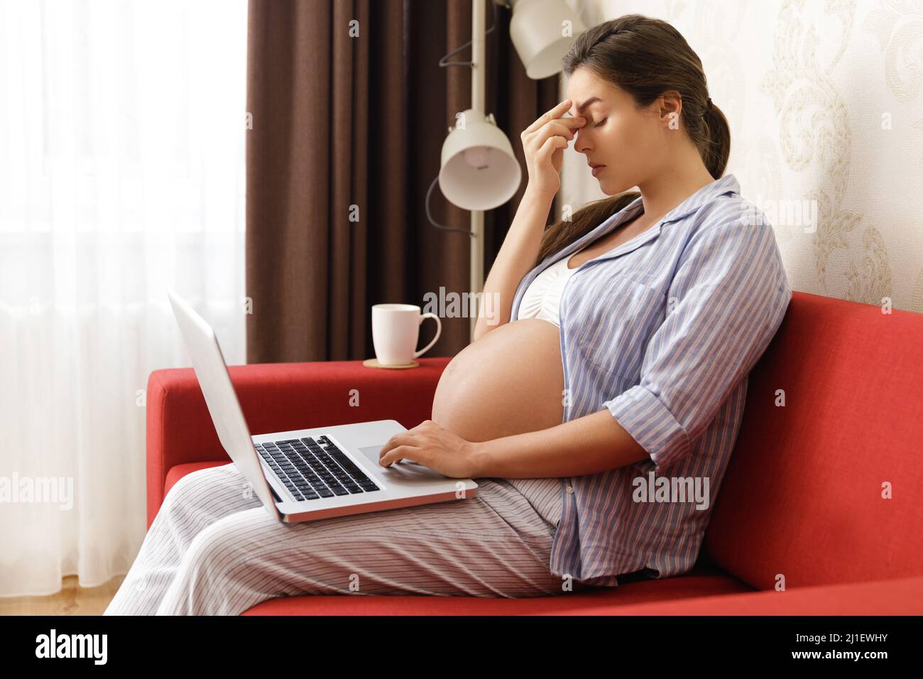 Beautiful tired young mother sitting hi-res stock photography and ...