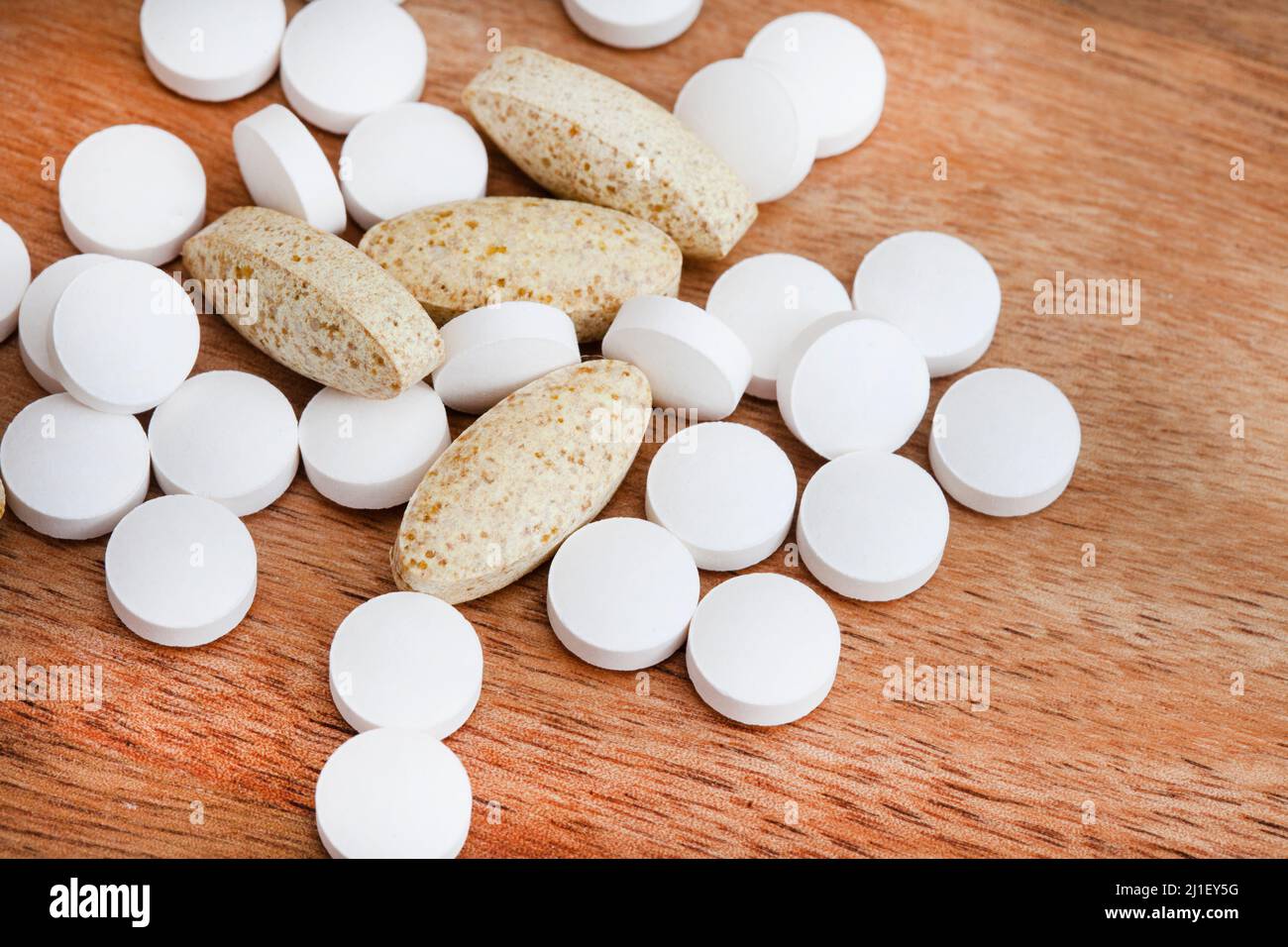 different medical tablets on wooden surface with no people and copy ...