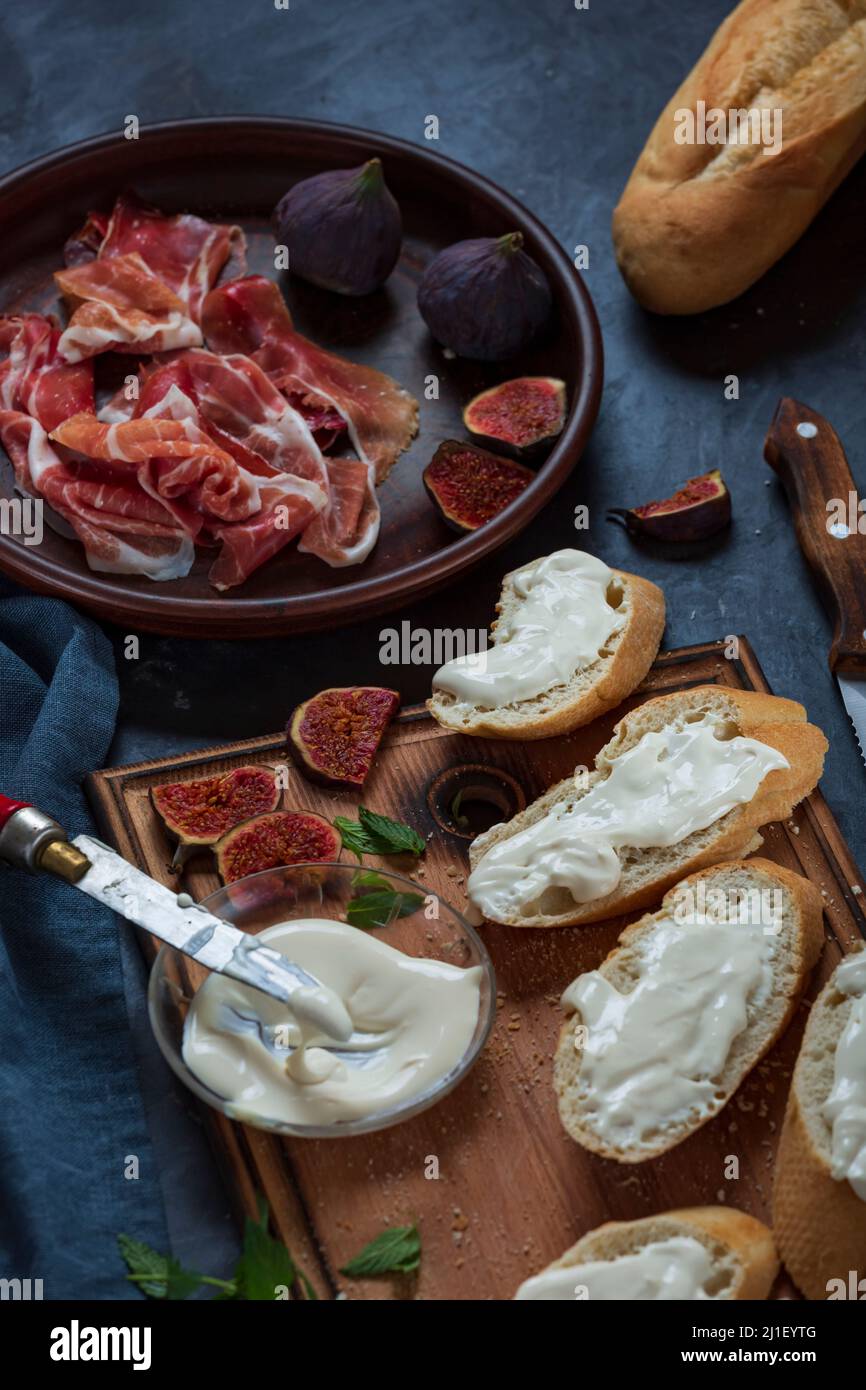 Making ham sandwiches and tapas ingredients, CLOSE UP Stock Photo - Alamy