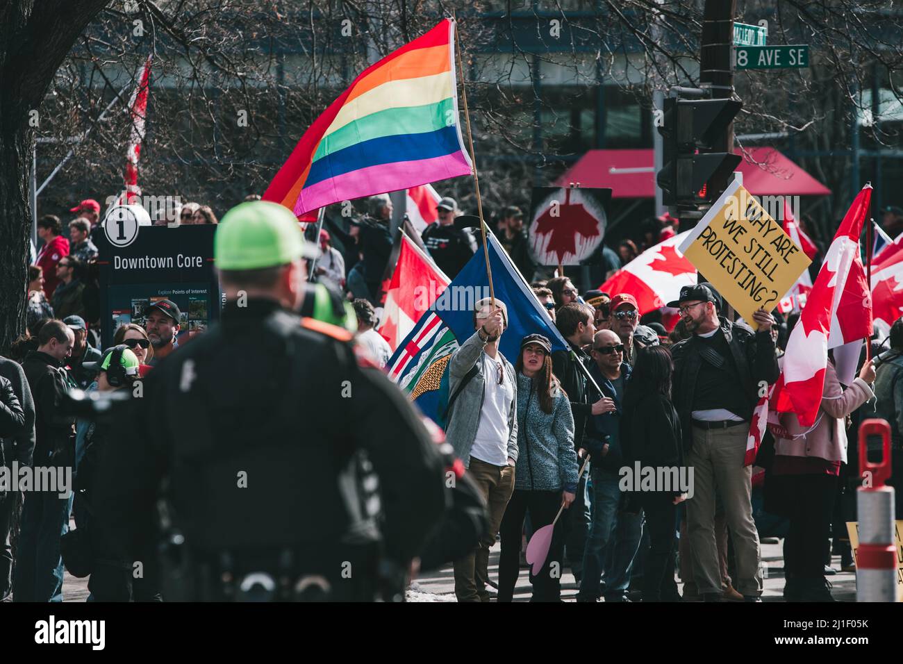 Protesters wave Canadian and rainbow flag at protest at City Hall Stock ...