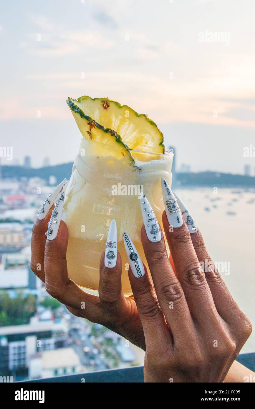 One Pina Colada Cocktail at a Rooftop Bar in Thailand Stock Photo - Alamy
