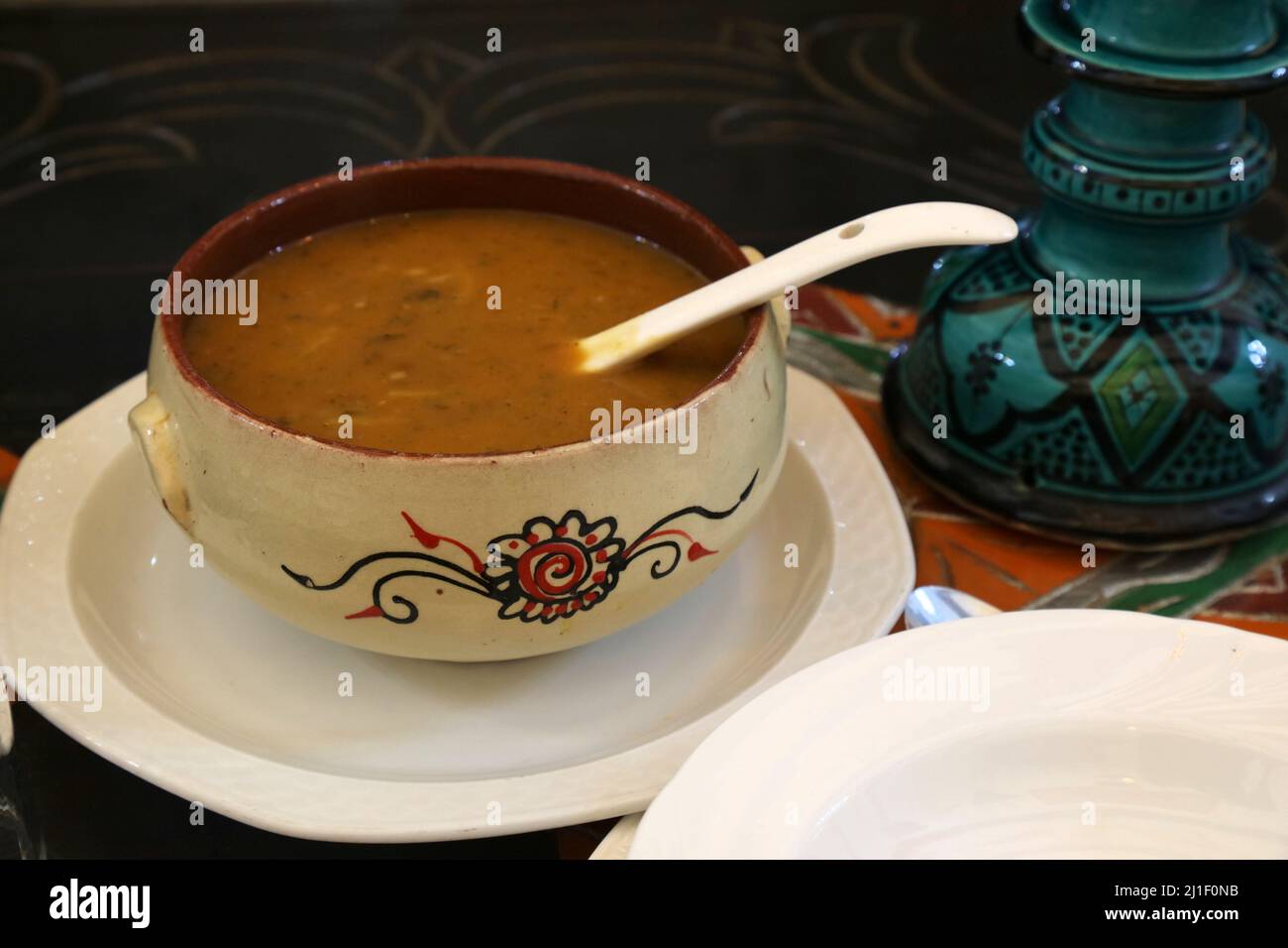 Harira soup made of tomato paste, lentils and chickpeas. Moroccan food ...