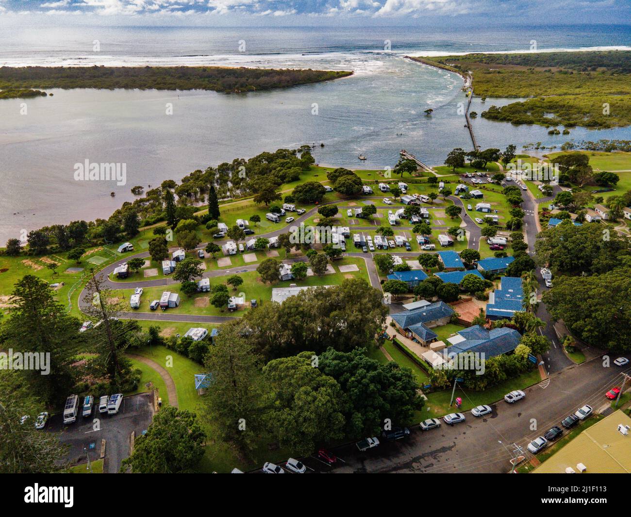 An aerial view of a beautiful landscape with ocean and buildings in ...
