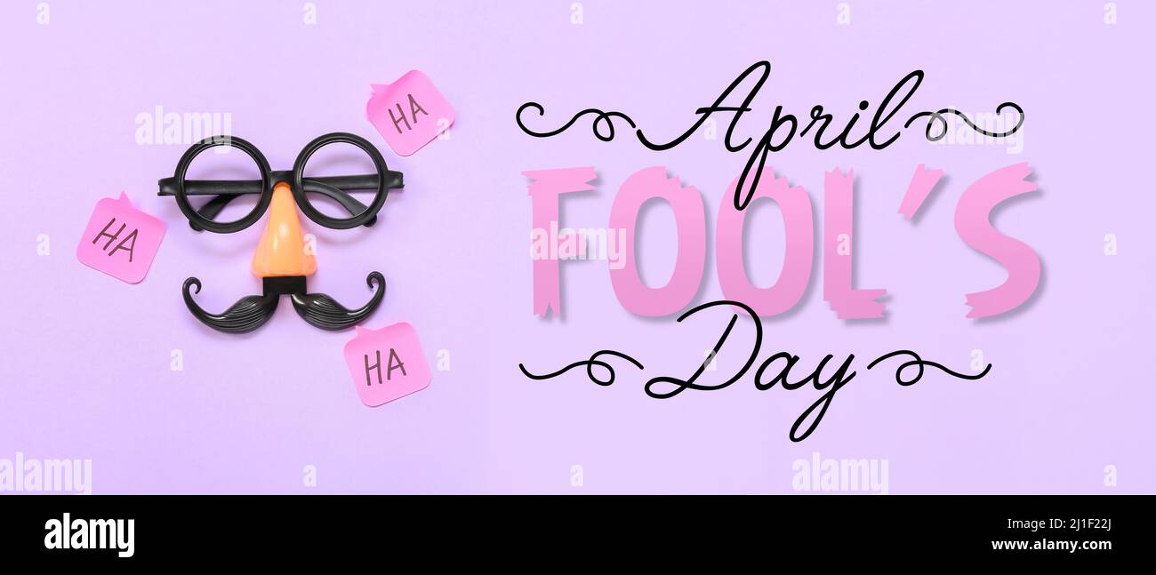 Party decor and sticky notes with word HA on color background. April ...