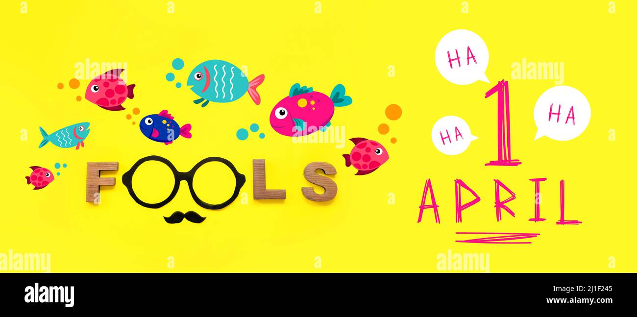 Word FOOLS and drawn fishes on yellow background. April Fool's Day ...