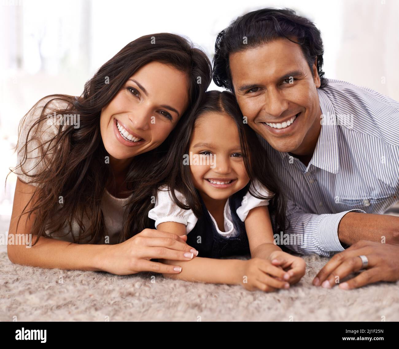 One happy family. Cropped portrait of an affectionate young family at ...