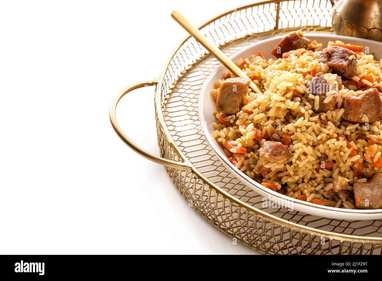 Tray with plate of traditional pilaf on white background Stock Photo ...