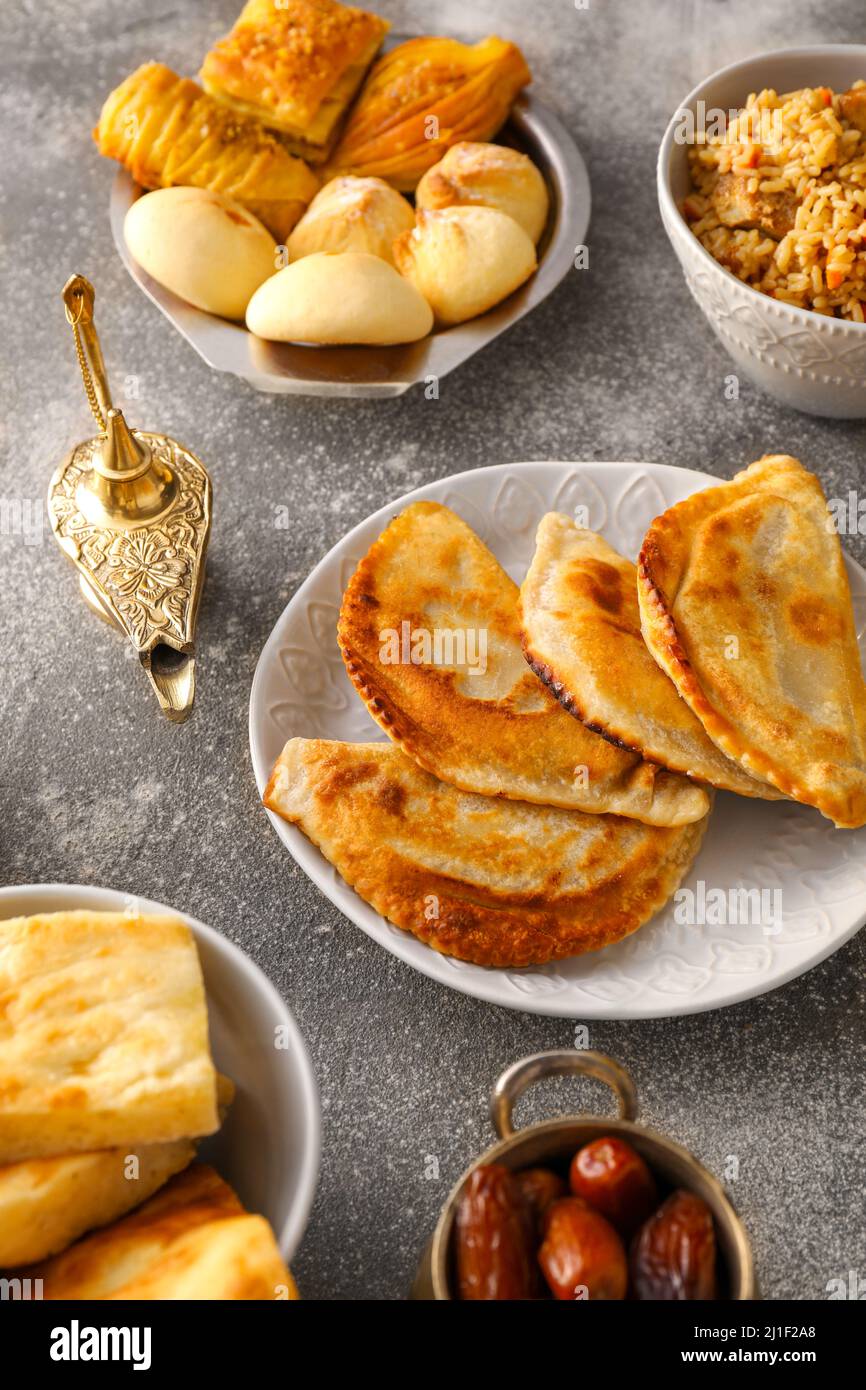 Traditional Eastern dishes with Aladdin lamp on grunge background Stock ...