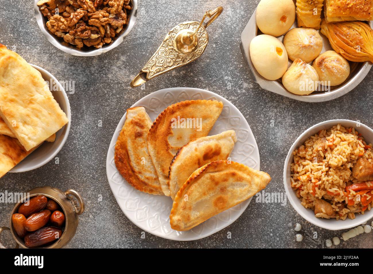 Traditional Eastern dishes with Aladdin lamp on grunge background Stock ...