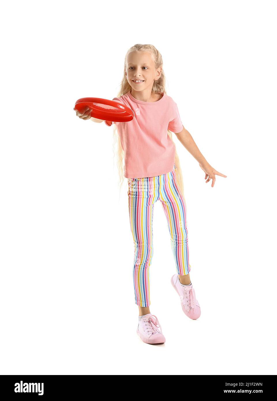 Funny little girl playing frisbee on white background Stock Photo - Alamy