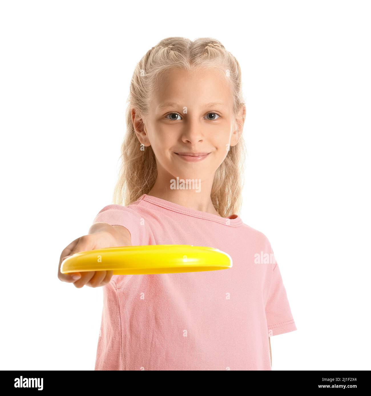 Funny little girl playing frisbee on white background Stock Photo - Alamy