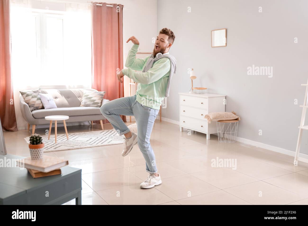 Cool young man dancing at home Stock Photo - Alamy