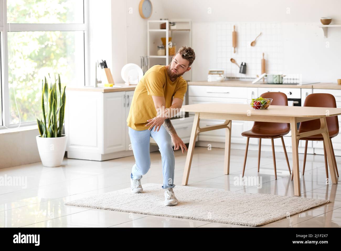 Cool young man dancing at home Stock Photo - Alamy