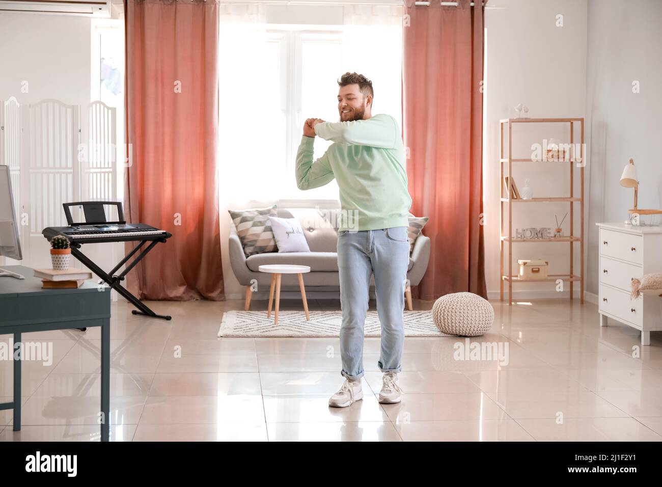Cool young man learning to dance at home Stock Photo - Alamy