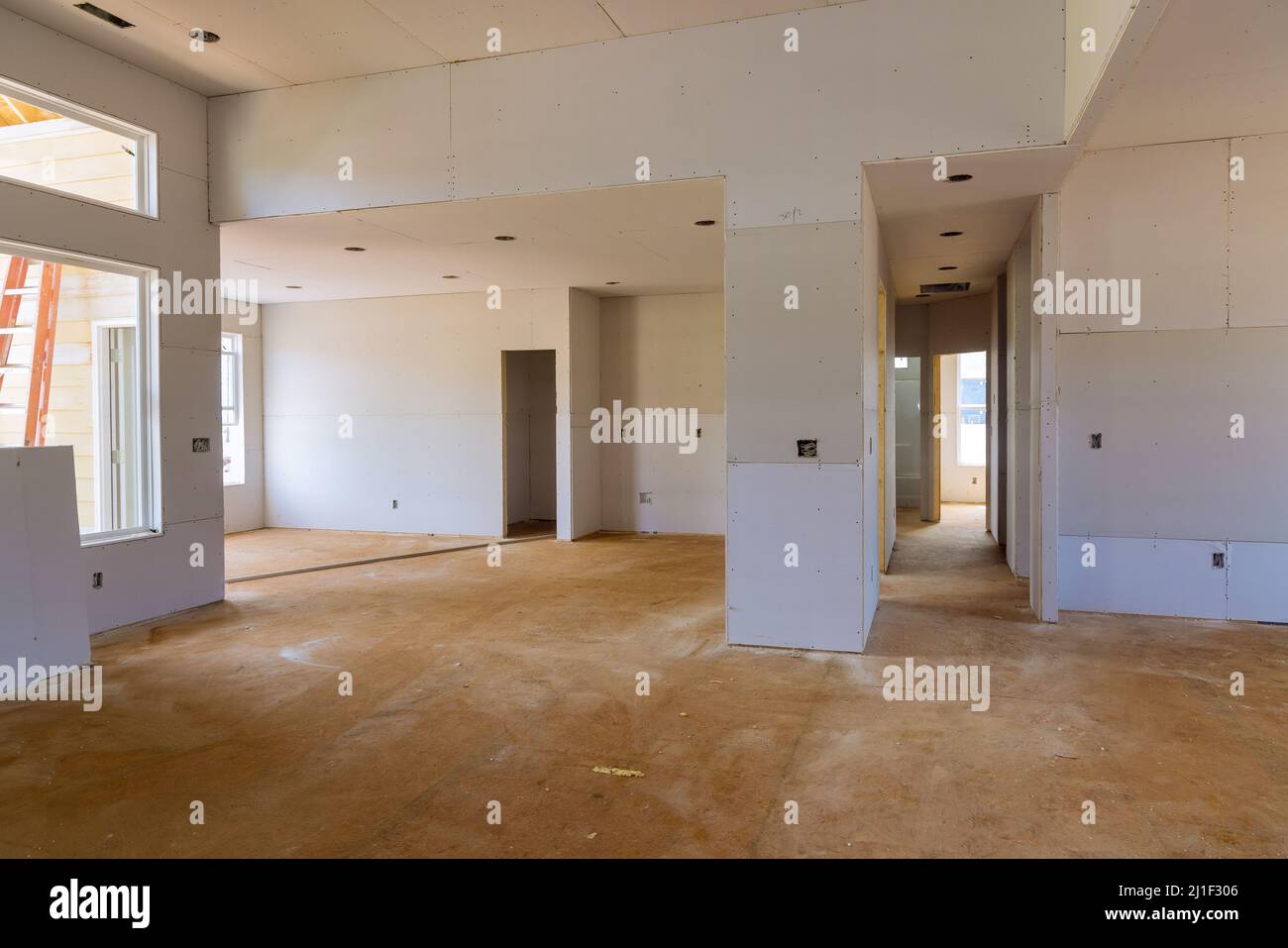 Finished sheetrock in new home construction interior room of drywall ...