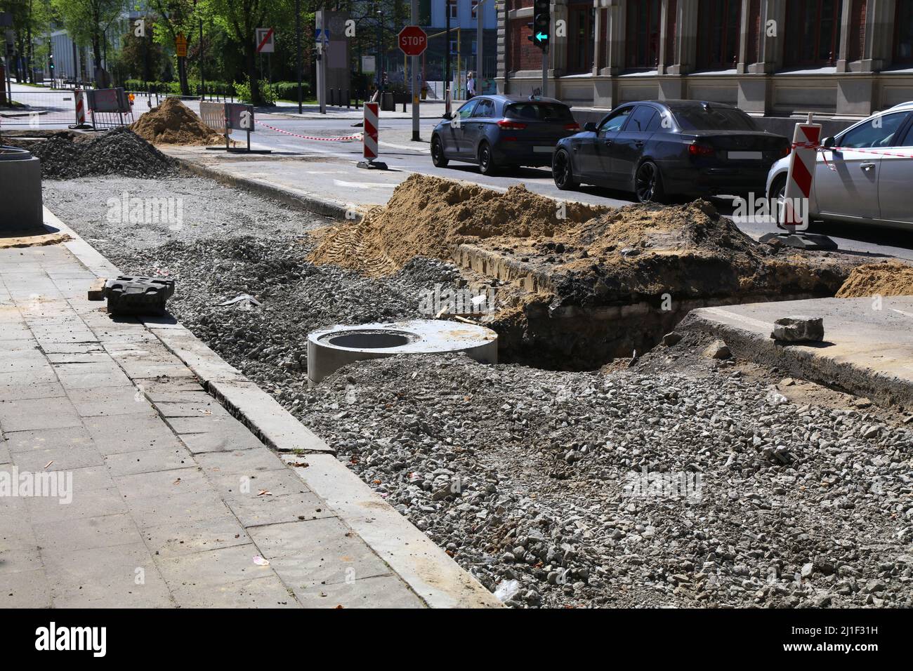 Street resurfacing - fresh city street repaving construction works in ...