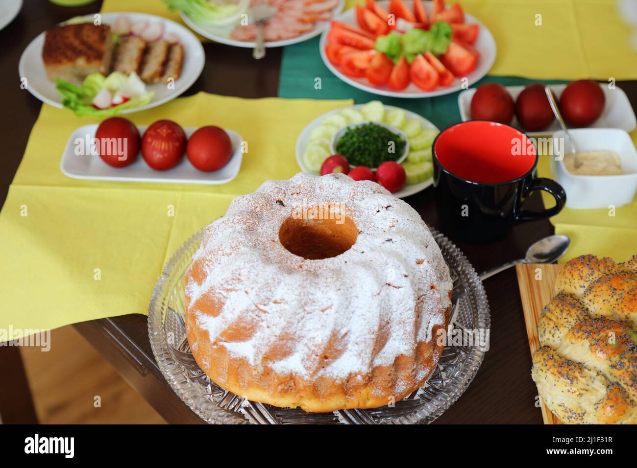 Babka cake on Easter breakfast table in Poland. Easter foods in Europe ...