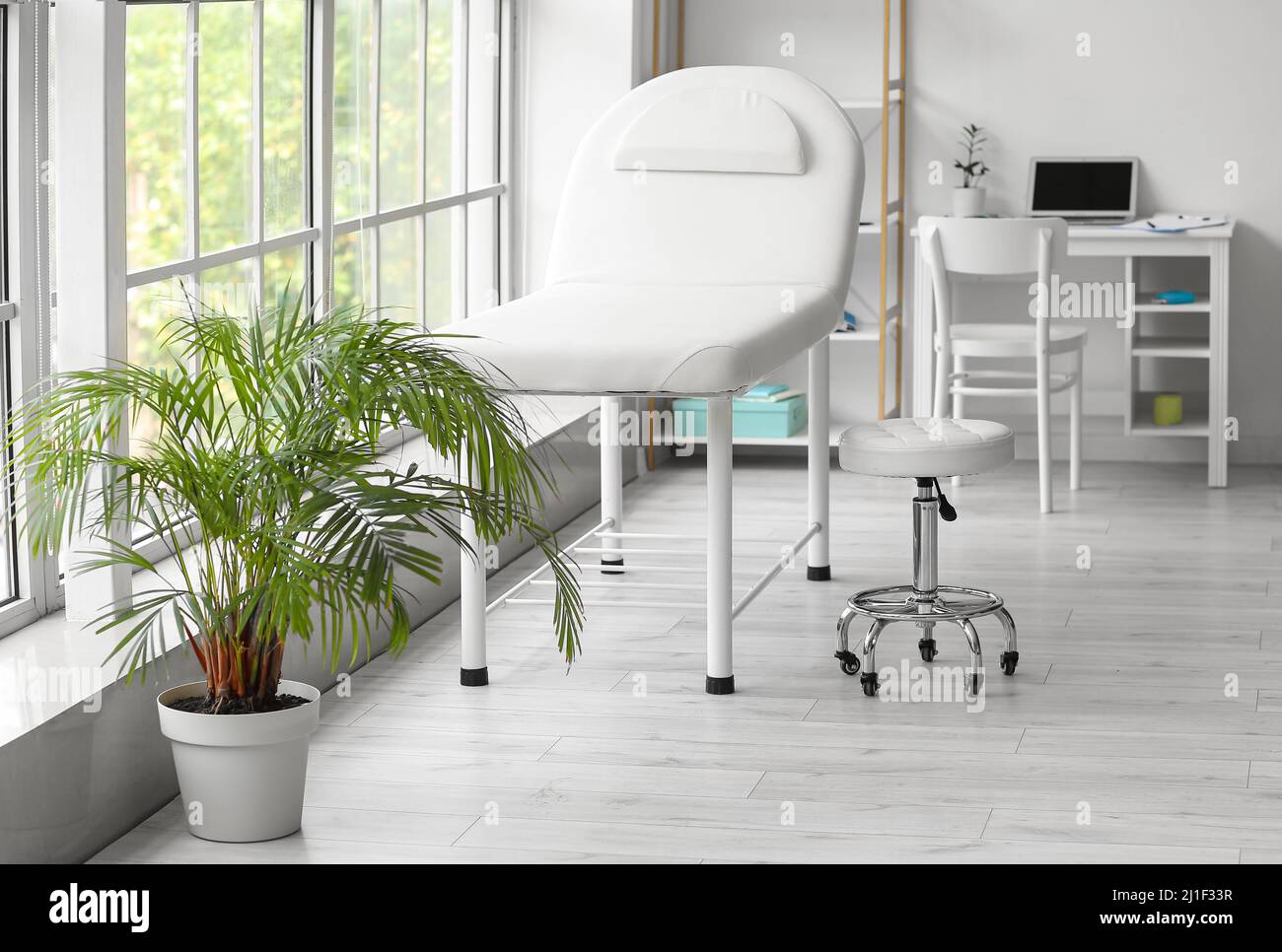 Medical couch in doctor's office Stock Photo - Alamy