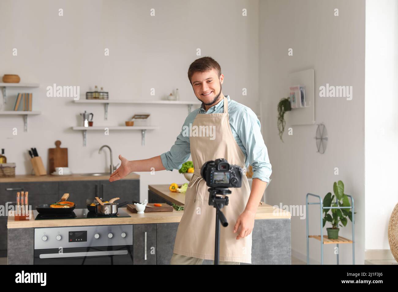 Cooking process smiling man hi-res stock photography and images - Alamy