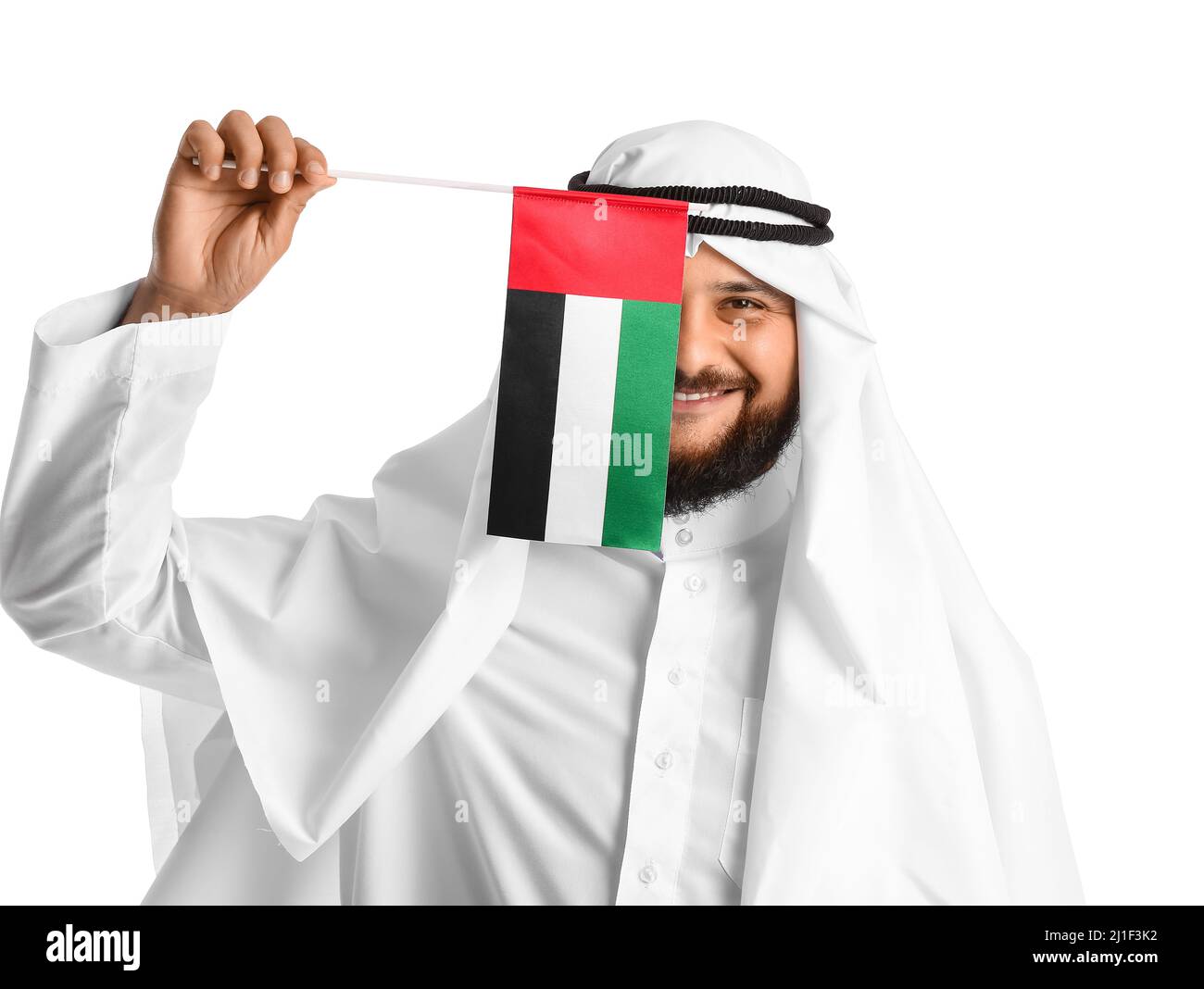 Man in traditional clothes and with the national flag of UAE on white ...