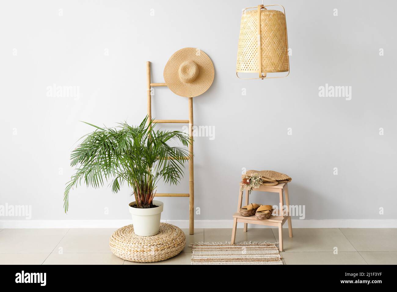 Interior of light room with hanging lamp, ladder and step stool Stock ...