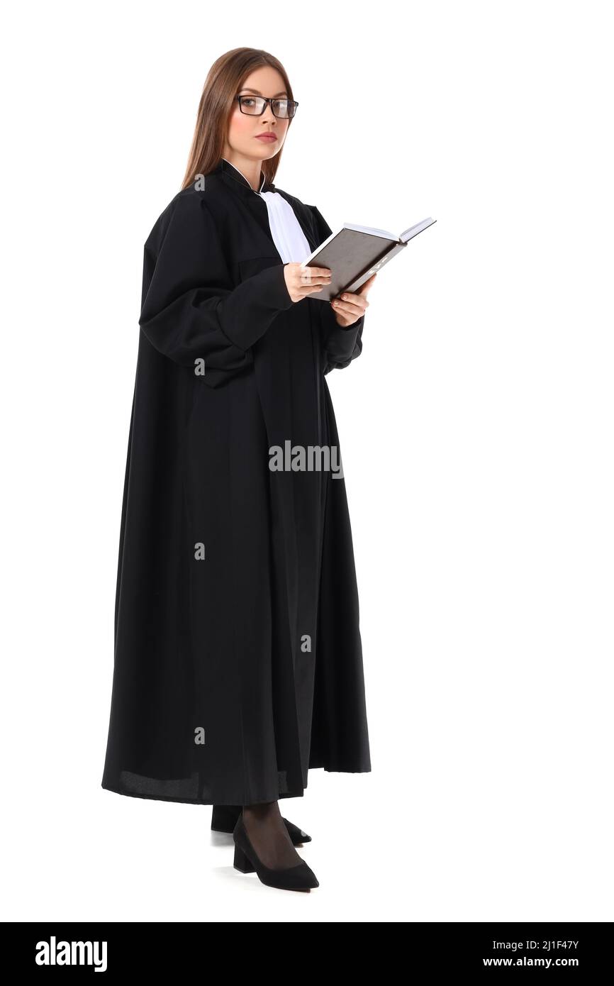 Young female judge with book on white background Stock Photo - Alamy
