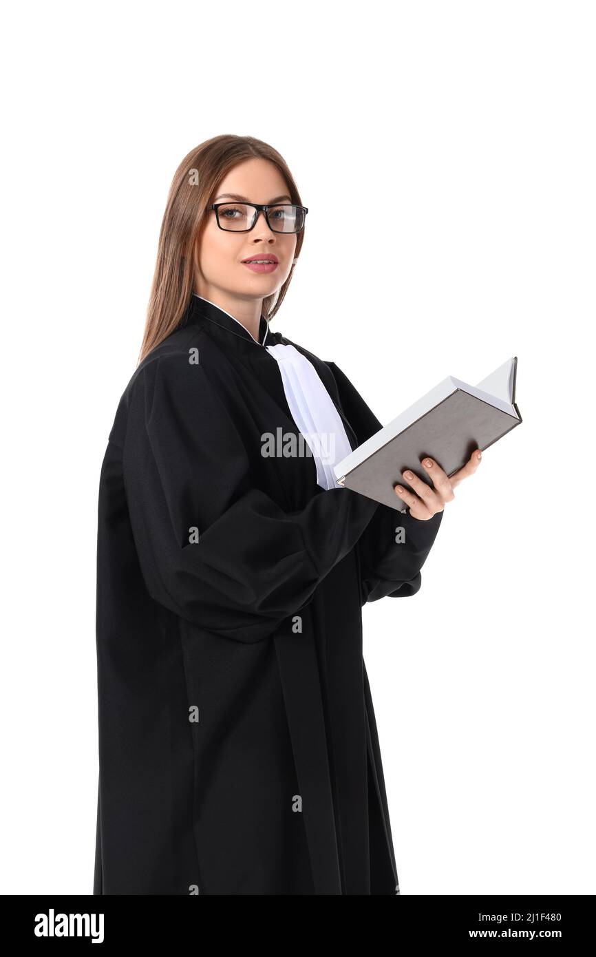 Young female judge with book on white background Stock Photo - Alamy