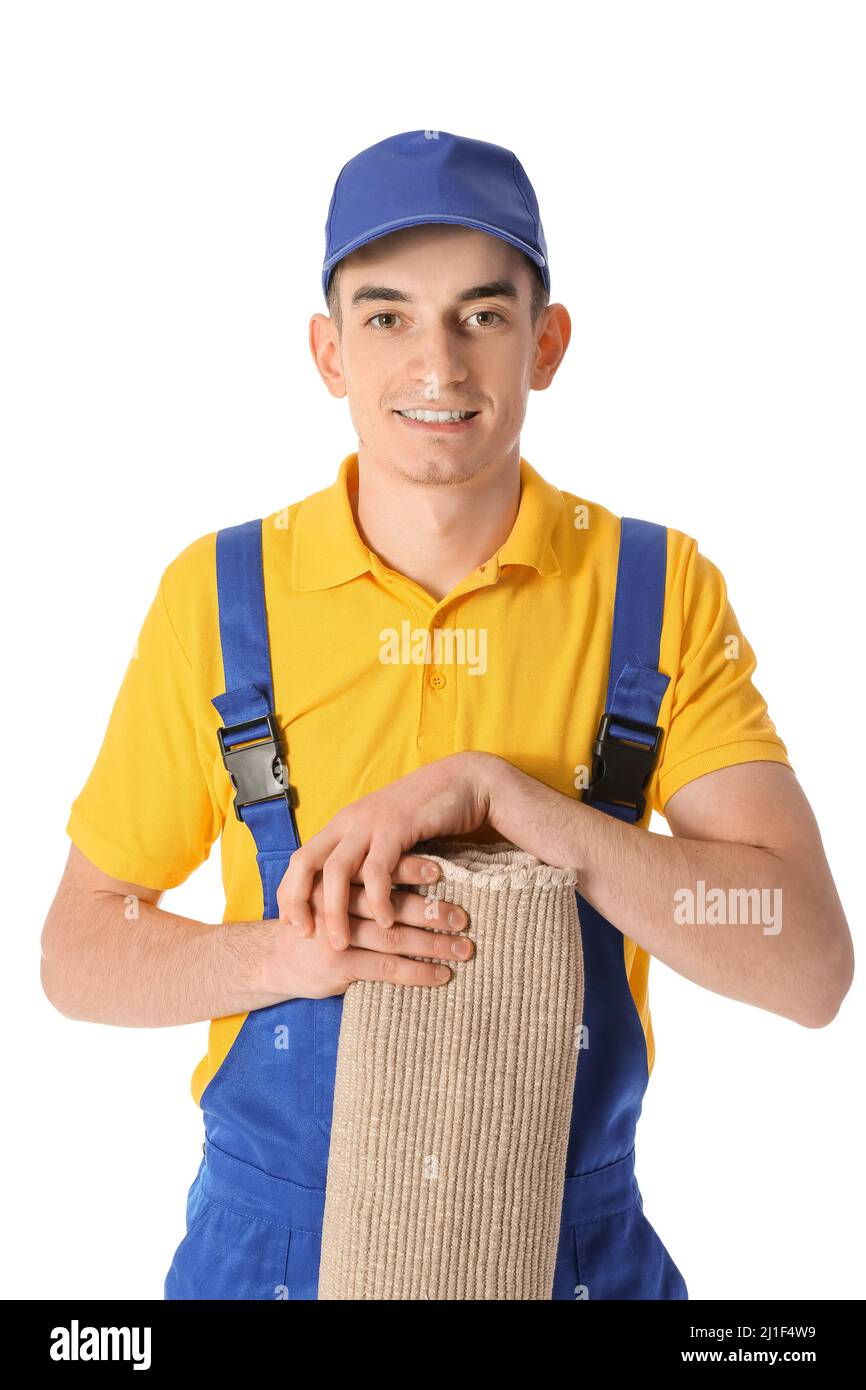 Male worker with rolled carpet on white background Stock Photo - Alamy