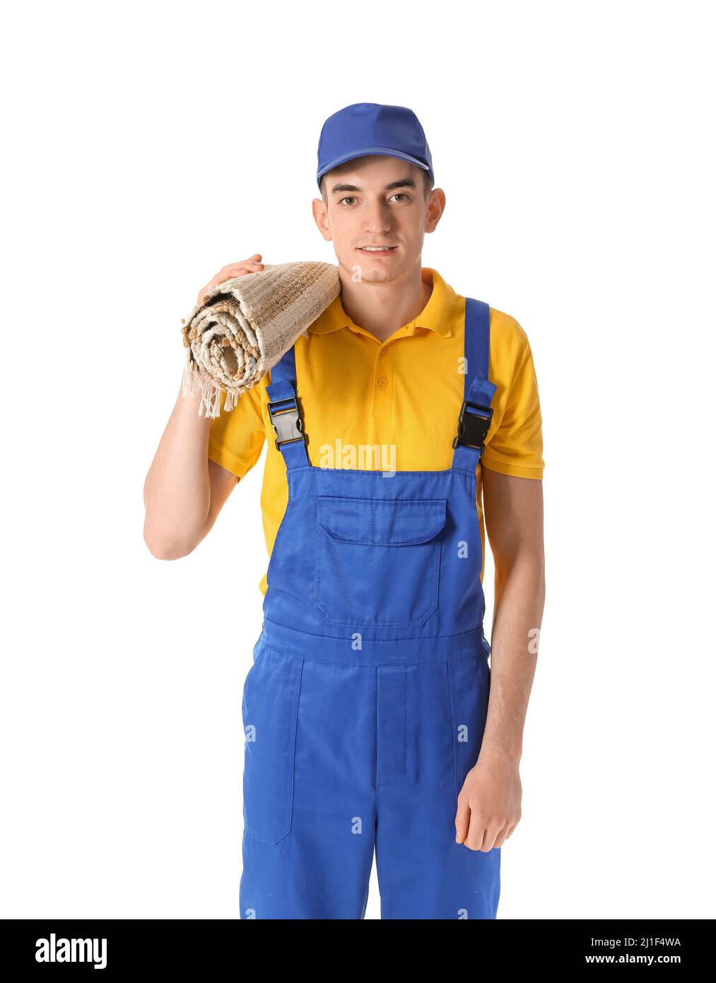 Male worker with rolled carpet on white background Stock Photo - Alamy