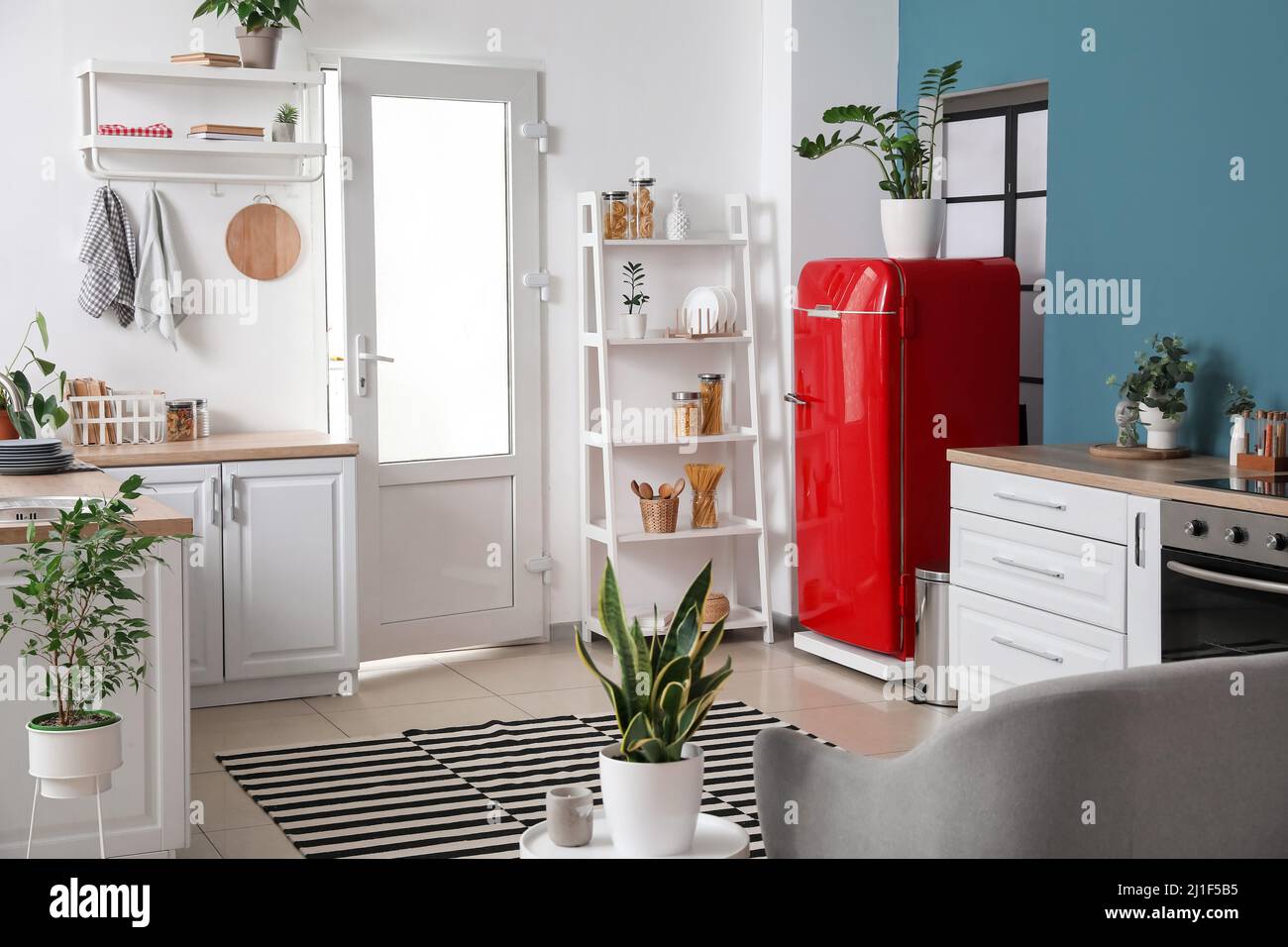 Red vintage fridge in interior of kitchen Stock Photo - Alamy