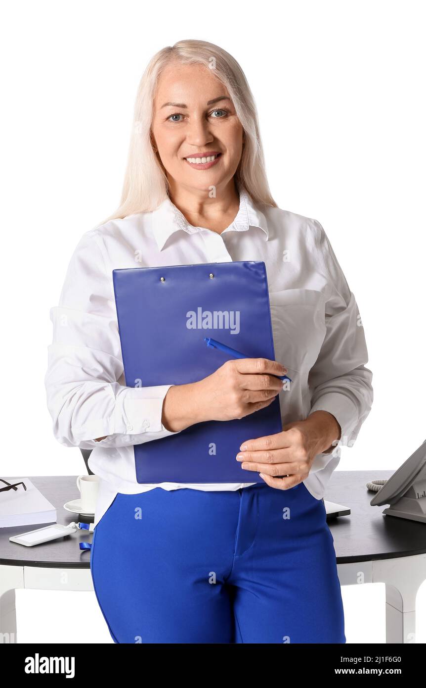 Mature secretary near her workplace on white background Stock Photo - Alamy