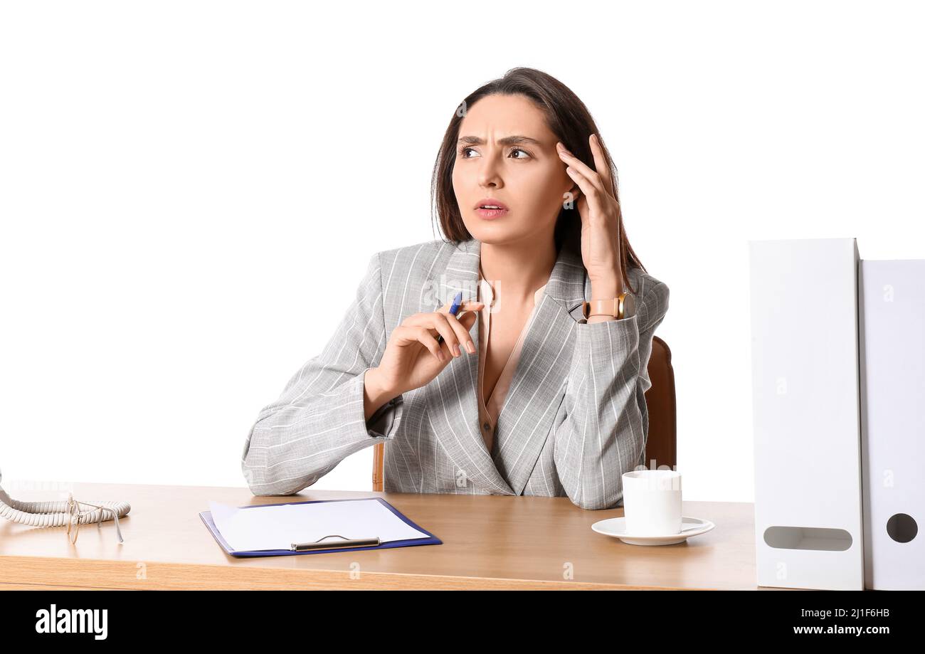 Young secretary at table on white background Stock Photo - Alamy