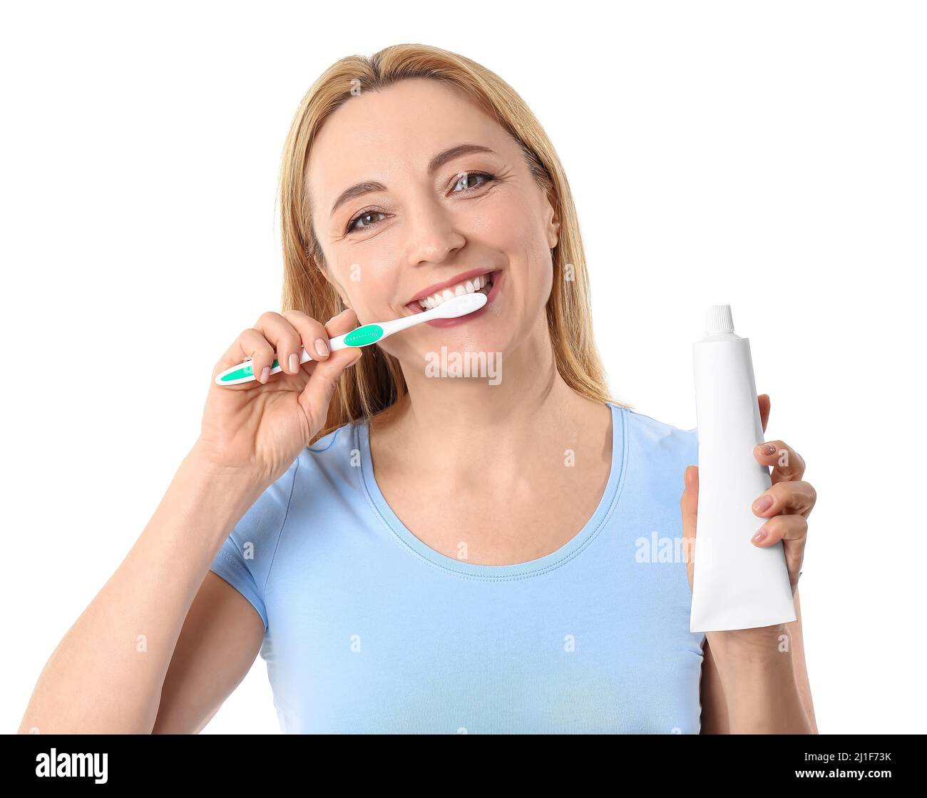 Beautiful mature woman brushing teeth on white background Stock Photo ...