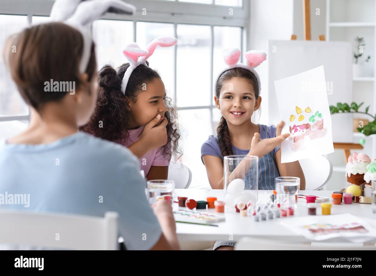 Cute children attending master-class in art on Easter eve Stock Photo ...