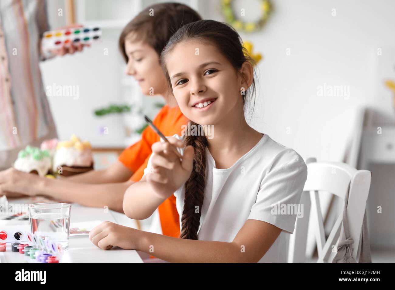 Cute children painting during master-class in art on Easter eve Stock ...