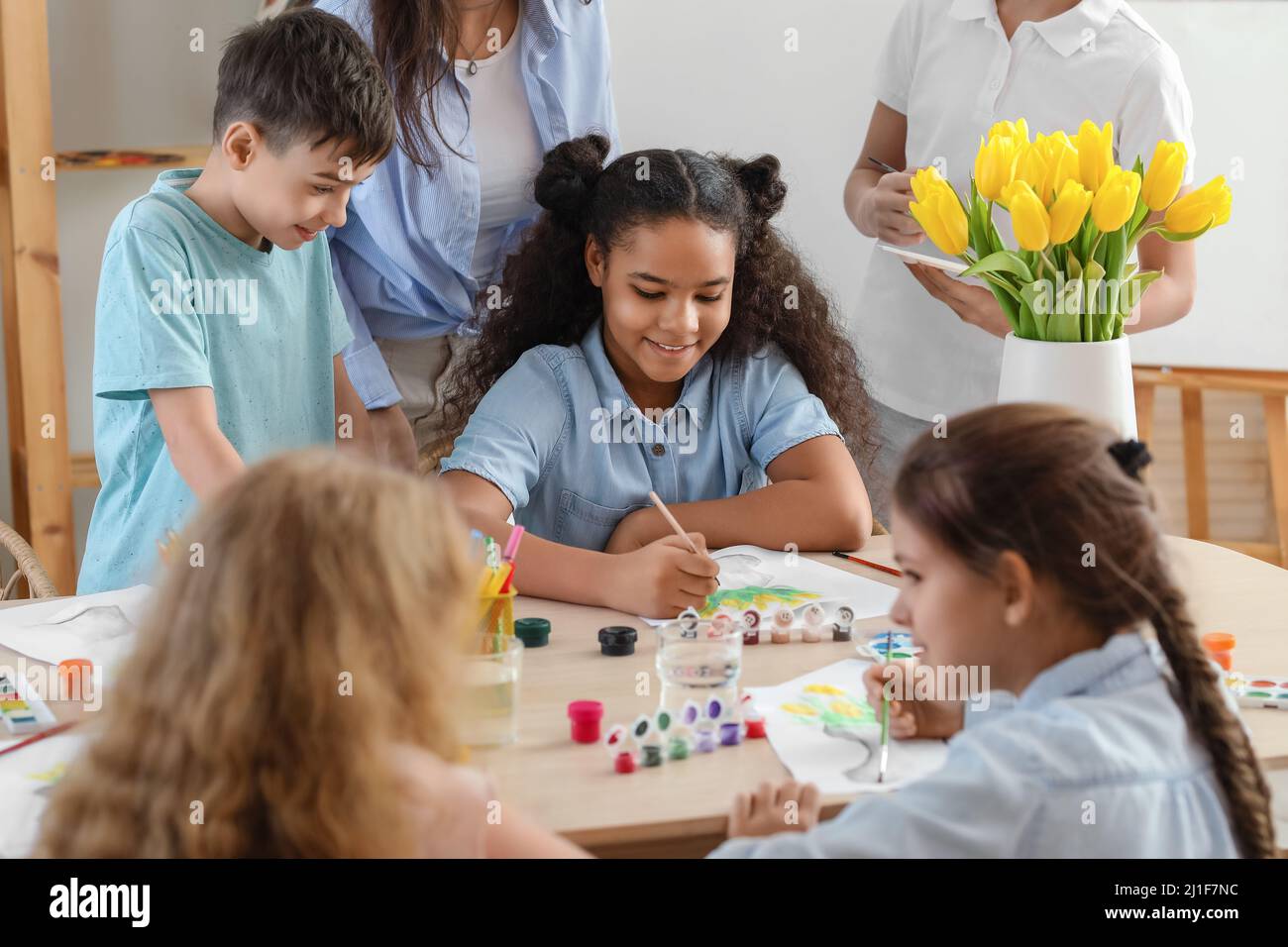 Cute children painting during master-class in art Stock Photo - Alamy