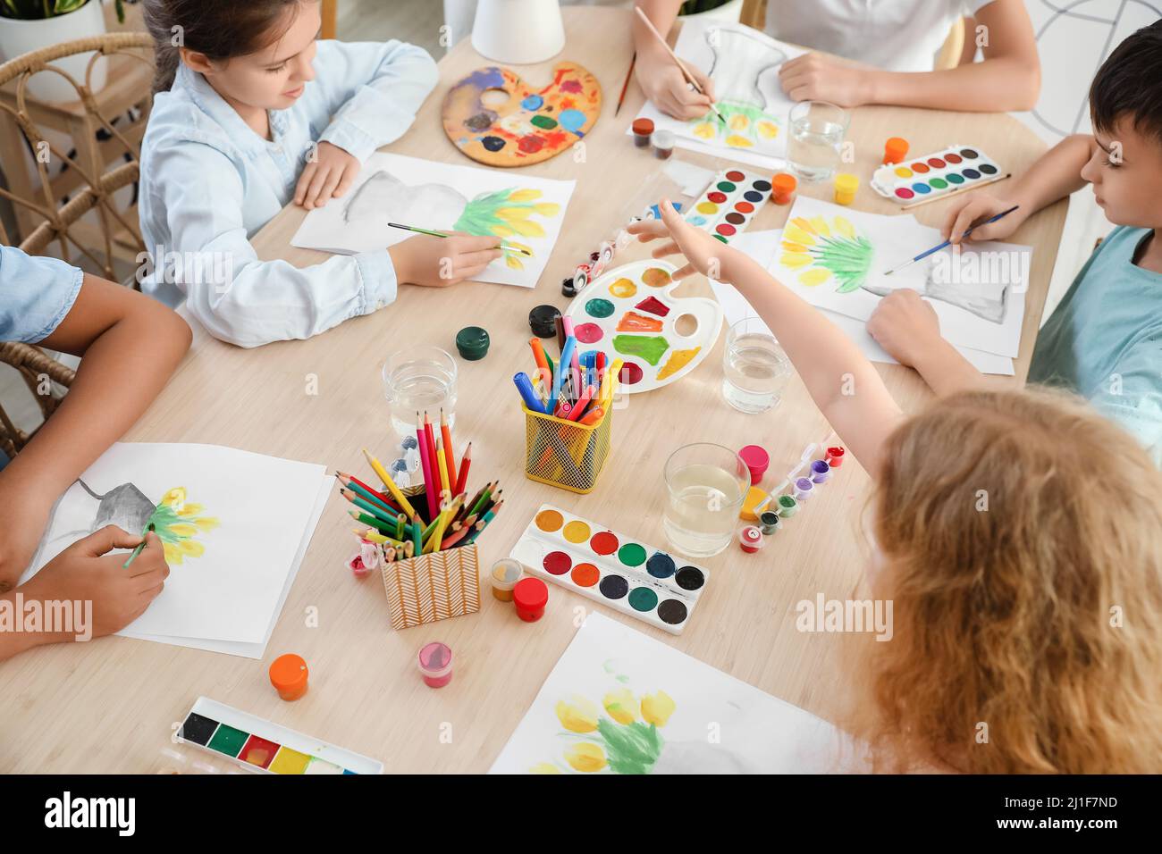 Cute children painting during master-class in art Stock Photo - Alamy