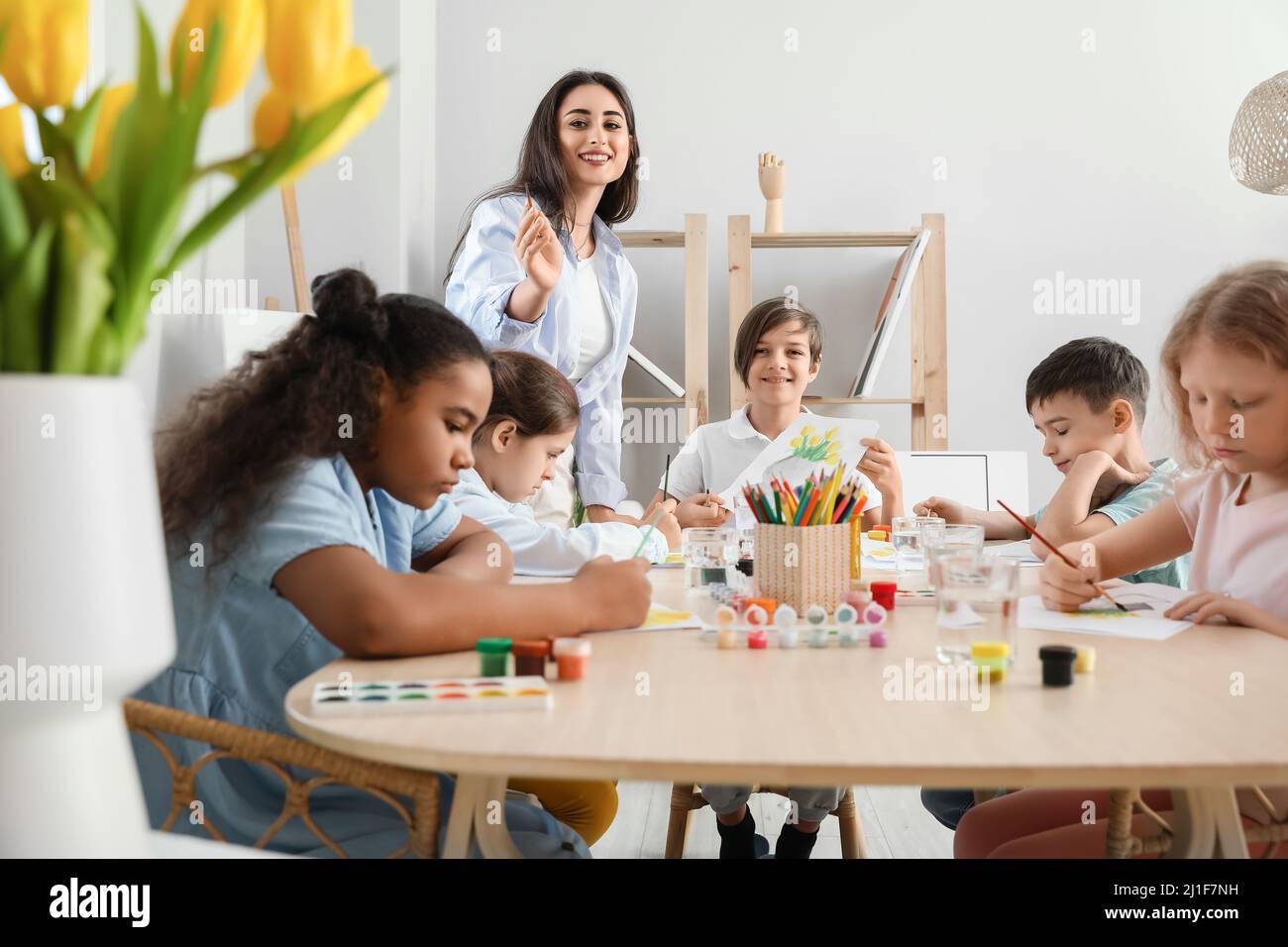 Cute children painting during master-class in art Stock Photo - Alamy