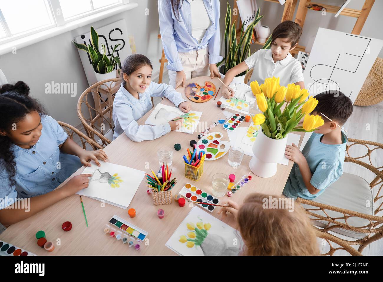 Cute children painting during master-class in art Stock Photo - Alamy