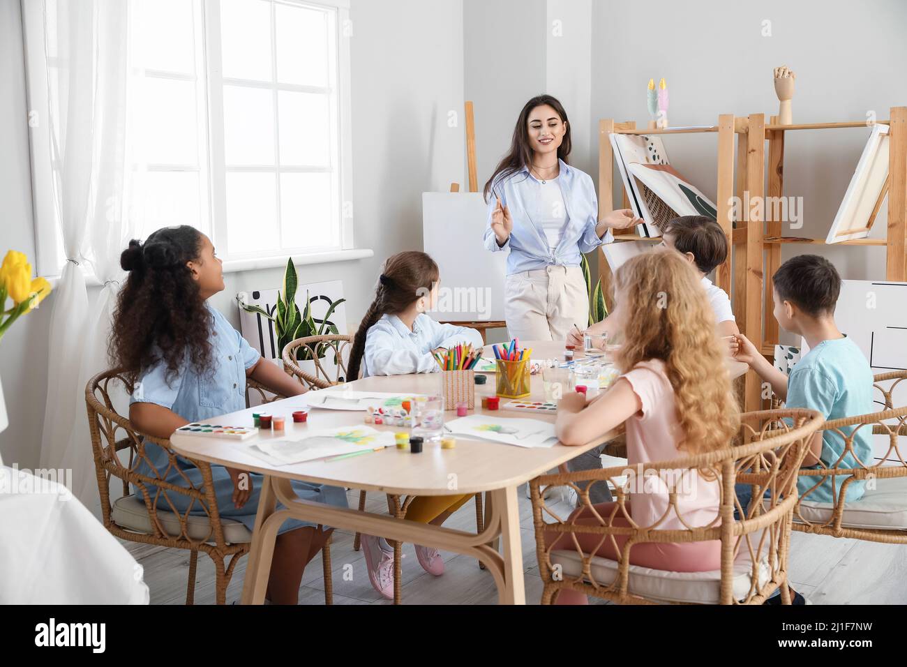Cute children painting during master-class in art Stock Photo - Alamy