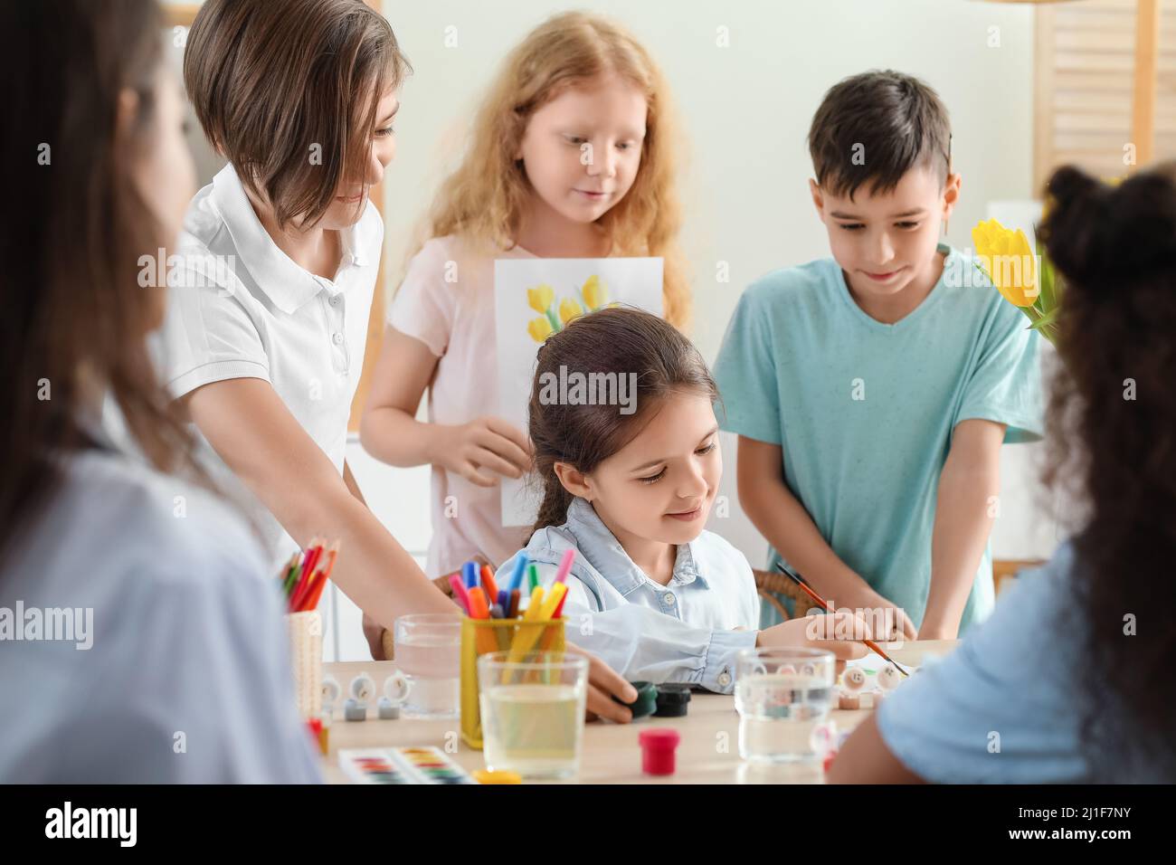 Cute children painting during master-class in art Stock Photo - Alamy