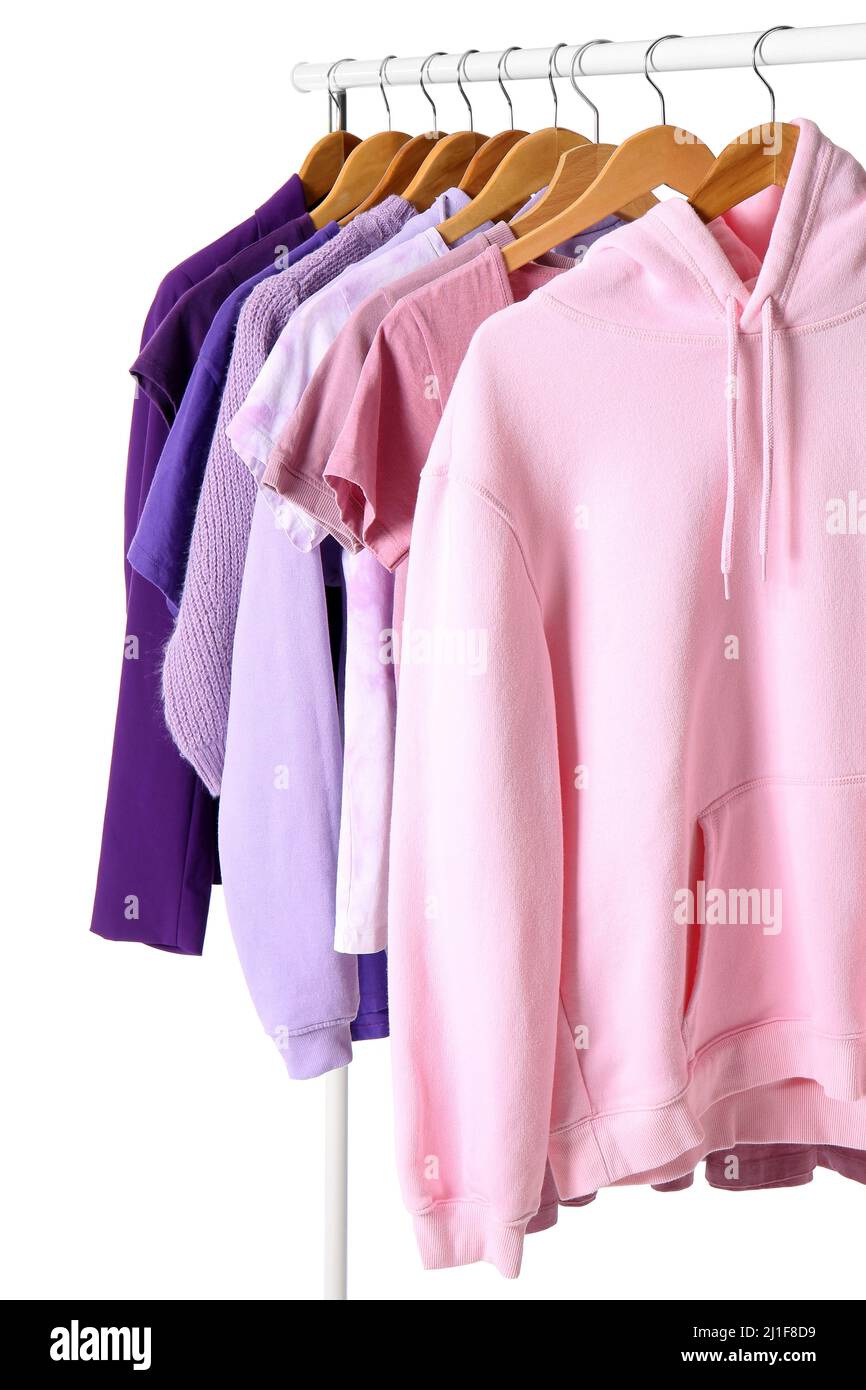 Rack with female clothes on white background Stock Photo - Alamy