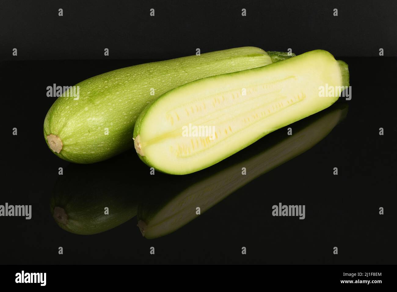 Zucchini isolated on acrylic black background. High resolution photo ...